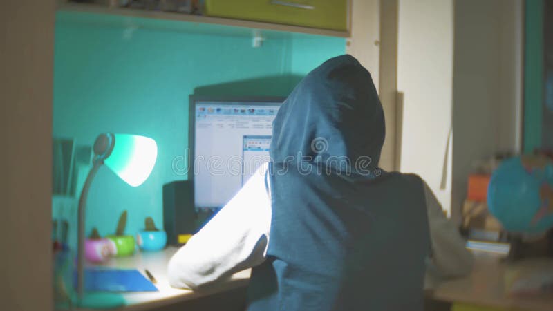 Hacker Man Programmer in the Hood Using Computer for Hack Information and Data from User Account ...