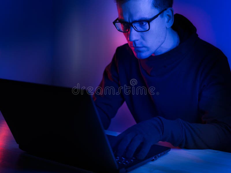 Hacker Man Using a Laptop Attacks the Web Network, Launches a Virus ...