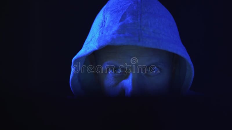 Hacker or Programmer Uses His Computer in a Dark Room or Basement Stock ...
