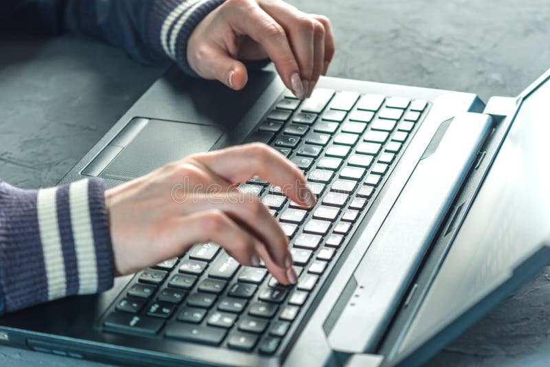 Hacker typing on a laptop stock photo. Image of danger - 30510976
