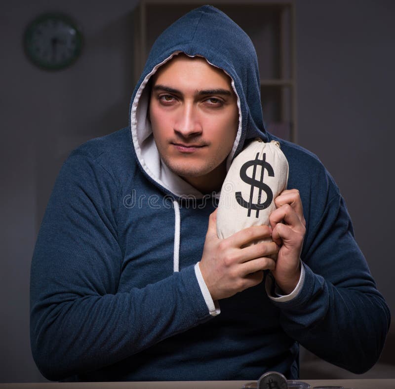 Hacker with sack of money stock photo. Image of economy - 194353378