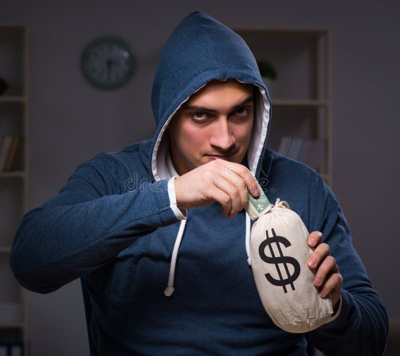 Hacker with sack of money stock photo. Image of fintech - 233205576