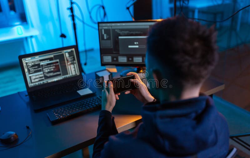 Hacker with Smartphone and Computers in Dark Room Stock Image - Image ...