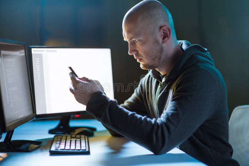 Hacker with Smartphone and Computers in Dark Room Stock Photo - Image ...