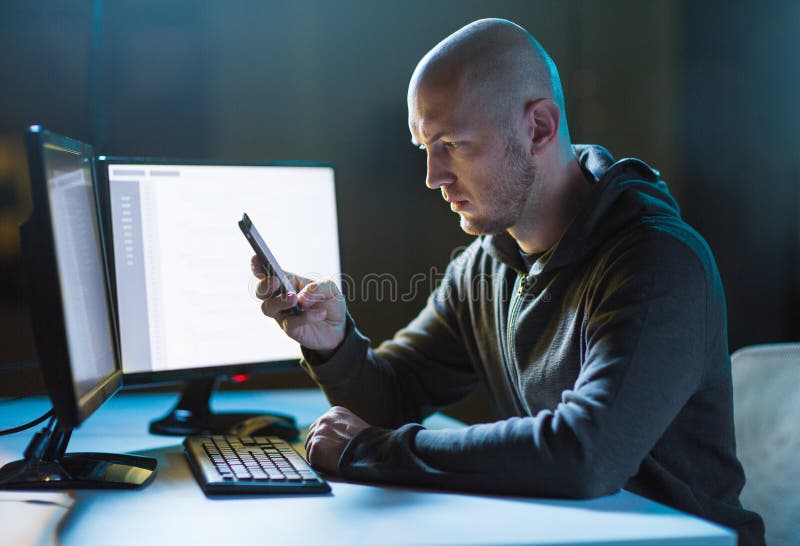 Hacker with Smartphone and Computers in Dark Room Stock Photo - Image ...