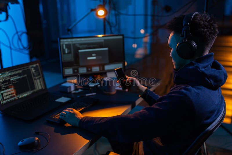 Hacker with Smartphone and Computers in Dark Room Stock Image - Image ...