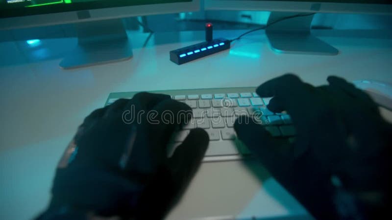 Hacker Stretching Hands in Black Gloves and Typing on a Computer Keyboard, Hacking Password ...