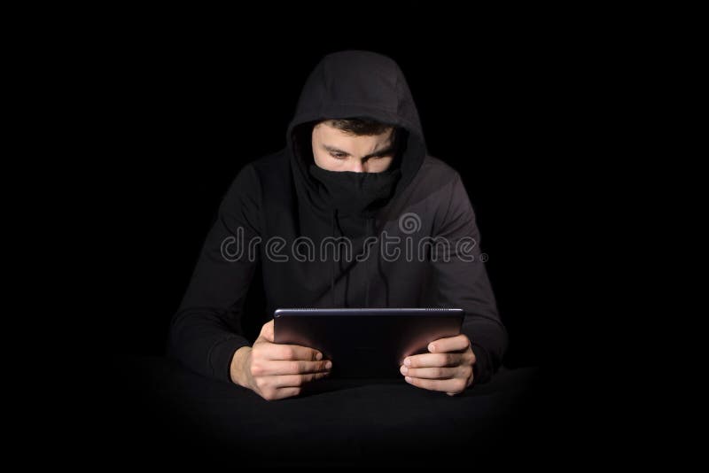 Hacker with Tablet PC Initiating Cyber Attack, on Black Stock Photo ...
