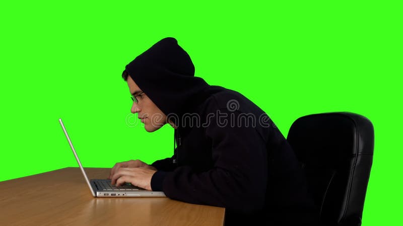 Hacker typing at his desk stock video. Video of green - 54616231