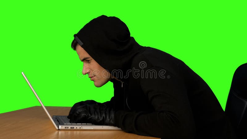 Hacker Typing at Computer Quickly on a Green Screen, Chroma Key. Stock ...