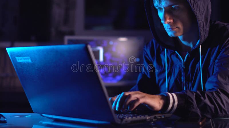 Hacker Typing Program Code While Committing A Cybercrime Hacking A System Firewall In The Dark