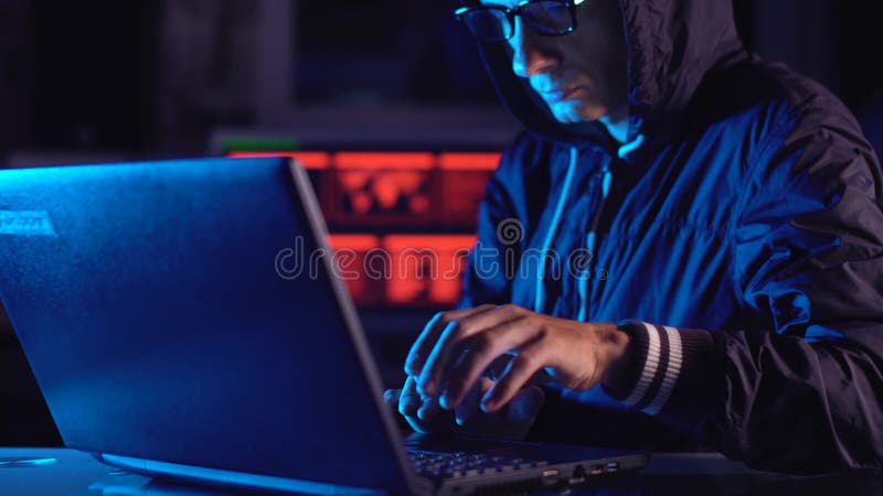 Hacker Typing Program Code While Committing A Cybercrime Hacking A System Firewall In The Dark