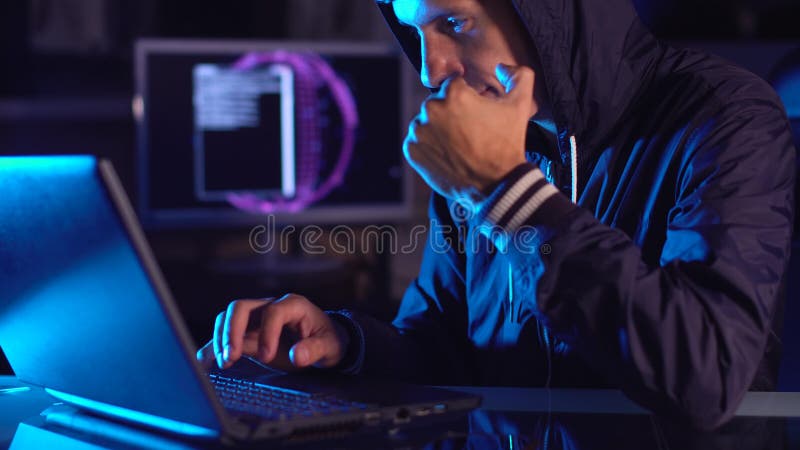 Hacker Typing Program Code while Committing a Cybercrime Hacking a System Firewall in the Dark ...