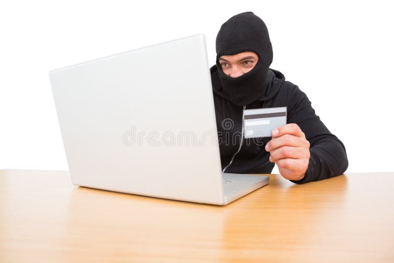 Unsmiling Hacker Typing on Keyboard Stock Photo - Image of identity ...