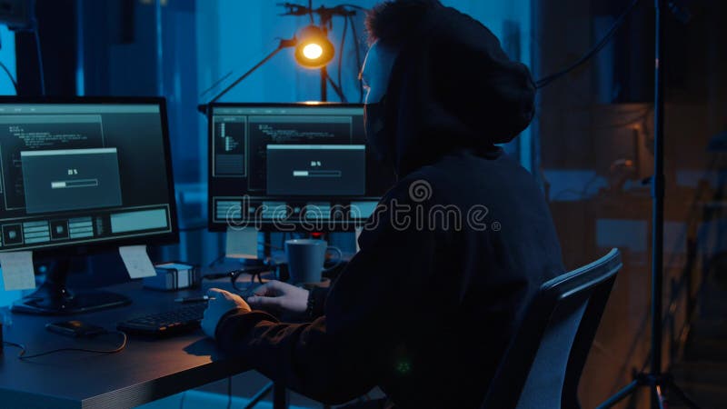 Hacker in Mask with Computer Making Cyber Attack Stock Footage - Video ...