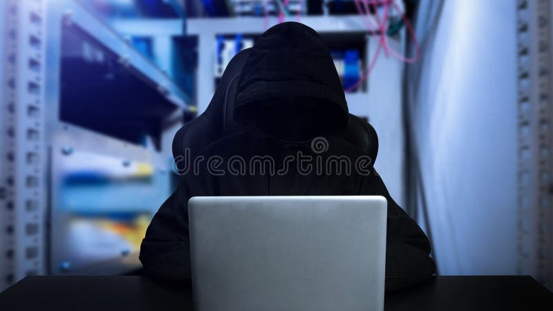 Hacker Using Computer with Digital Interface while Sitting at Desk of ...