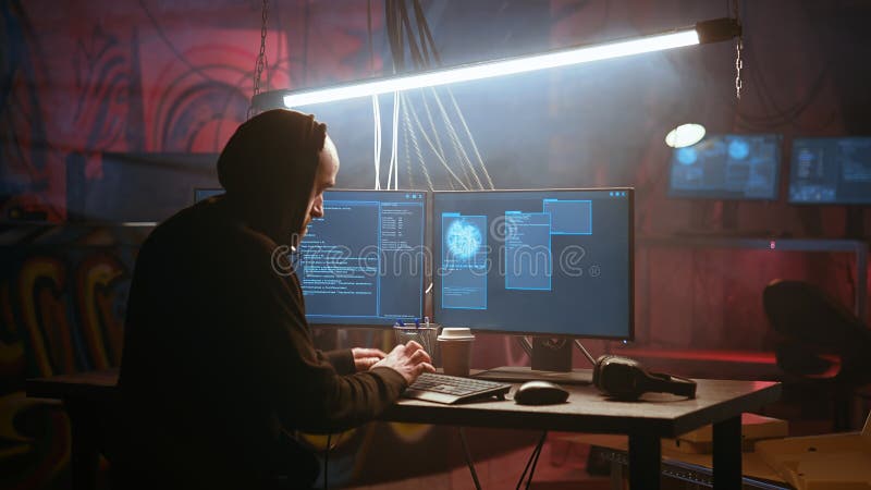 Hacker Using Computer To Run Malicious Code in Foggy Dark Basement ...