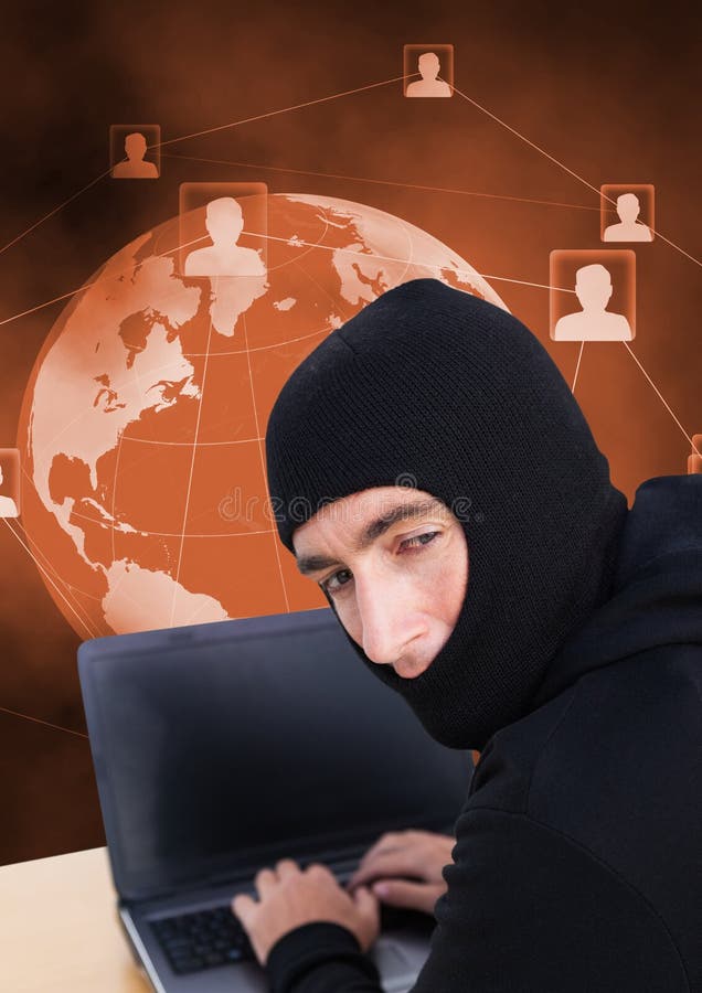 Hacker Using a Laptop Looking at the Camera Stock Photo - Image of ...