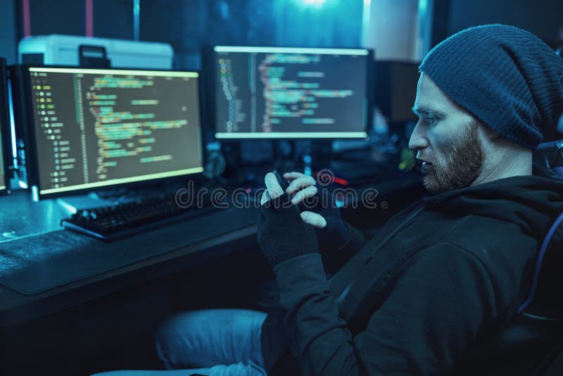 Hacker using mobile phone stock image. Image of laptop - 163933015