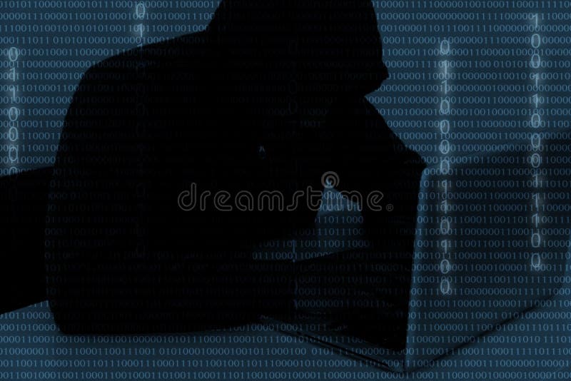 Hacker Wearing a Hooded Top Using Laptop Computer in the Dark. T Stock ...