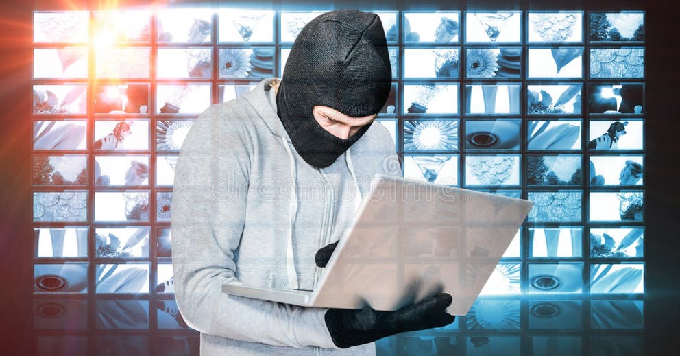Hacker Wearing Monkey Cap while Using Laptop Stock Photo - Image of ...