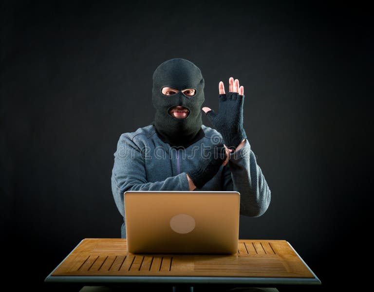 Hacker at work stock photo. Image of black, balaklava - 61864800