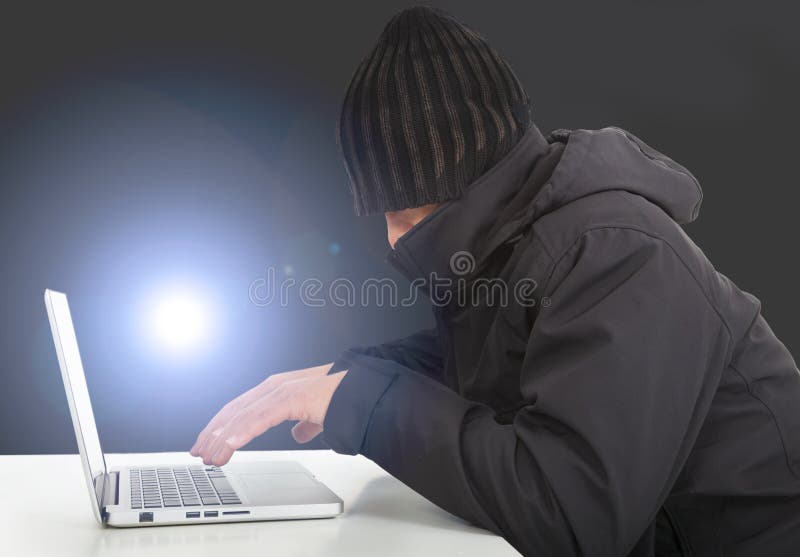 Hacker Working with a Laptop Computer in the Darkness Stock Photo ...