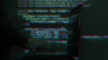 Hacker Writing Code Cracking Computer. Programming Code in the ...