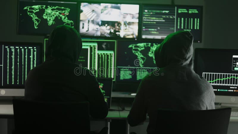 Hackers Working On Computers Showing World Maps And Security Camera 7105