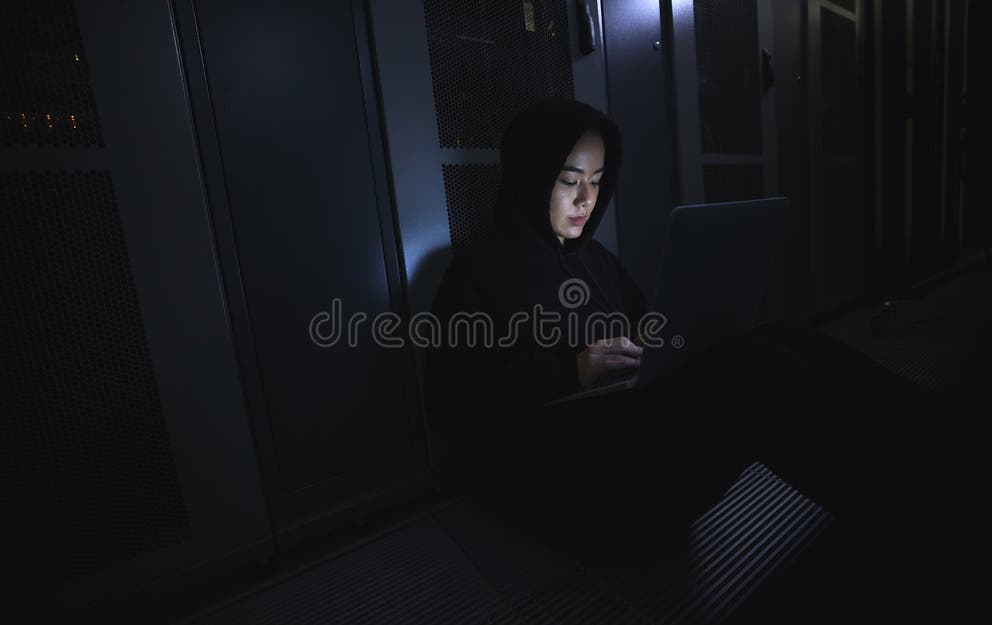 Hacking, Laptop and Hacker Woman in Dark Server Room for Coding Software, Data Center Crime or ...