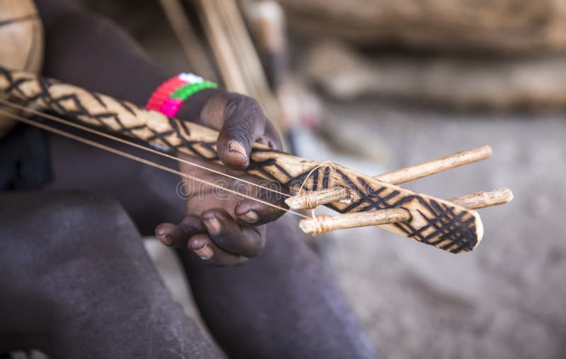 Hadza Man Playing Home Made Musical Instrument Stock Photo - Image of ...