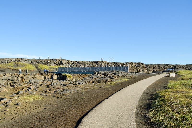 People Walking on the Bridge between Continents Near Hafnir in Iceland ...