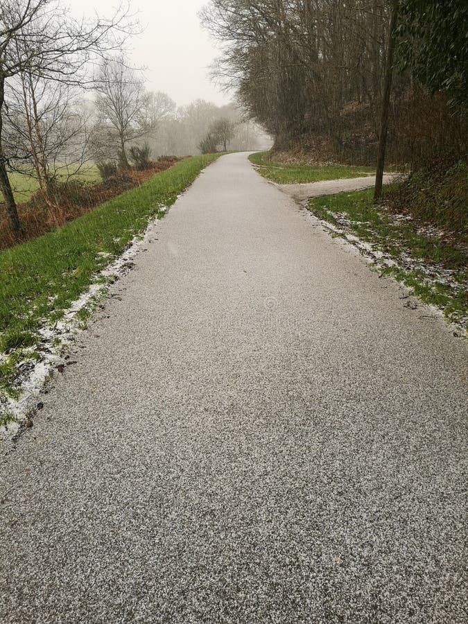 Hail-covered path stock image. Image of asphalt, infrastructure - 209162829