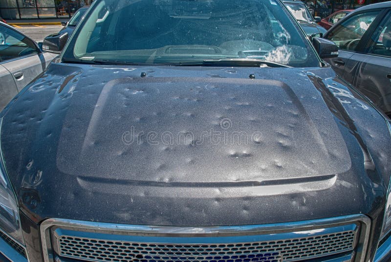 Hail damage to windshield stock photo. Image of windshield - 64941588