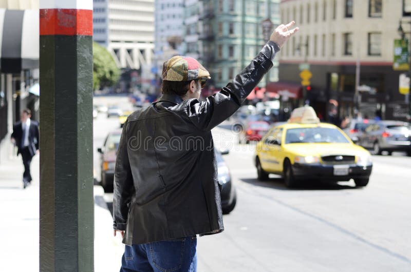 Hailing a taxi cab stock photo. Image of jeans, taxi - 19904118