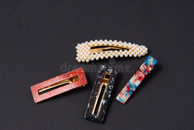 Hair Clips of Different Colours and Different Styles on a Dark ...