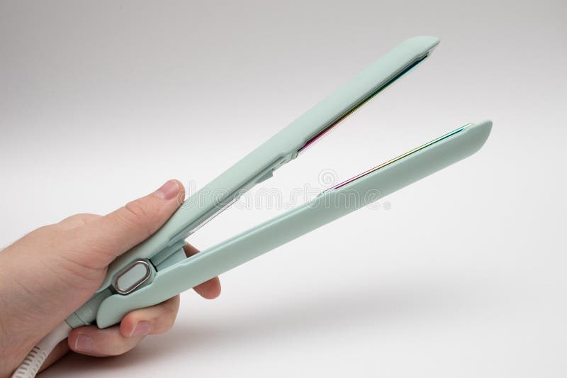 Hair Straightener with Ceramic Plates on Hand Stock Photo - Image of ...