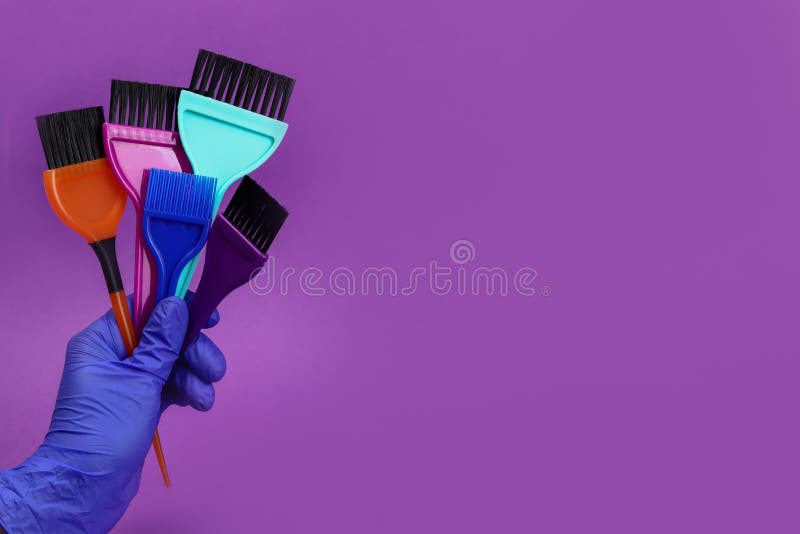 Hair Stylist Holds Hair Coloring Brushes in Hand Stock Image - Image of ...