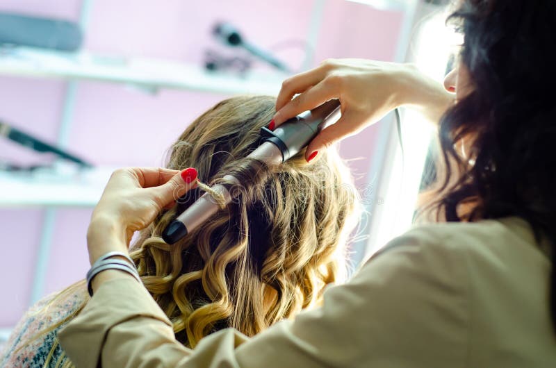 Hair Stylist Making Curls stock photo. Image of parlour - 145429112