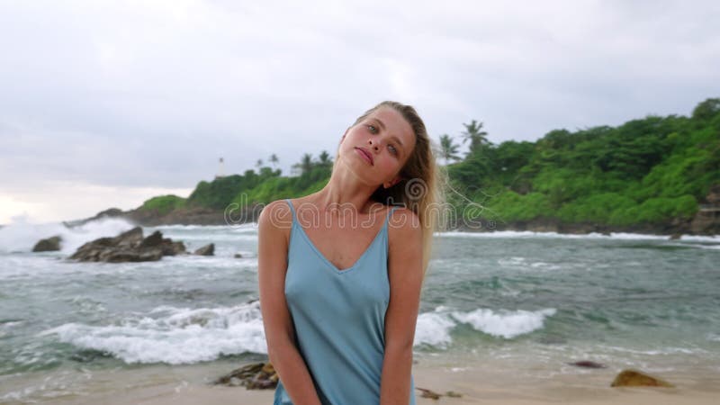 Blonde Woman Flips Long Hair On Tropical Beach Haircare In Nature