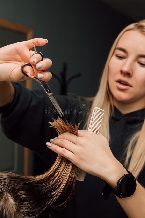 A Hairdresser Cuts A Clientand X27 S Hands Of The Hairdresser