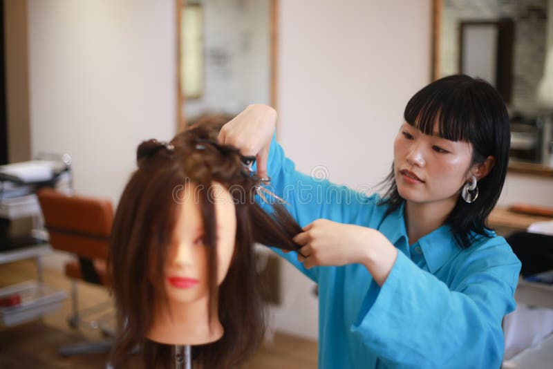 Hairdresser Practicing Hair Cutting Stock Photo - Image of class, smile ...