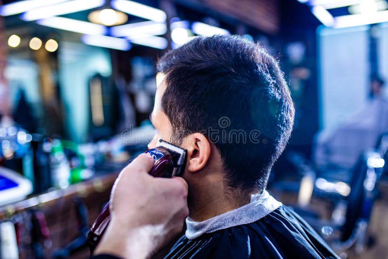 Hairstylist Cutting Hair of Male Customer at Barber Shop Stock Photo ... Hairstylist Cutting Hair of Male Customer at Barber Shop Stock Photo ...