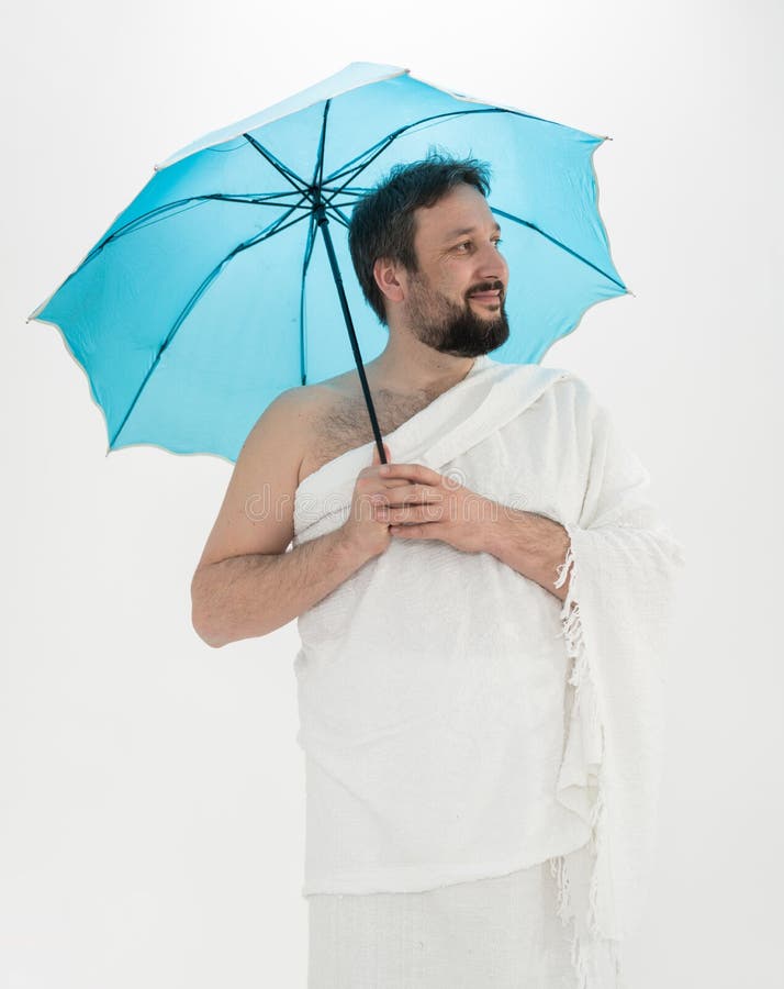 Hajj pilgrim with umbrella stock photo. Image of islam - 146916648