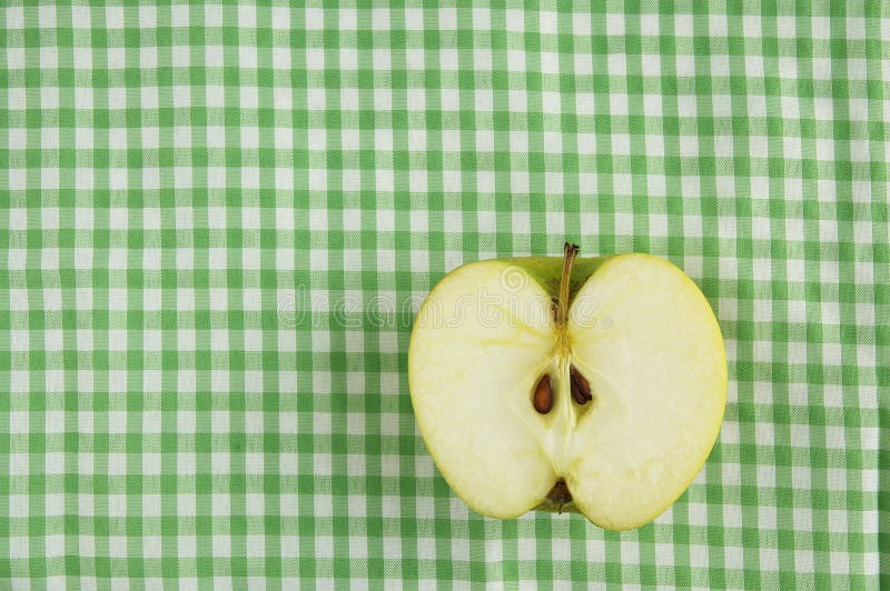 A Half of Apple on Tablecloth Stock Photo - Image of green, tablecloth ...