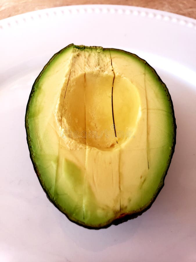 Half of a avacado sliced stock image. Image of fruit - 209637159