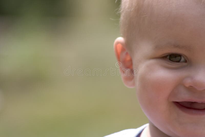 Half baby face cheerful stock photo. Image of pleasant - 1257606