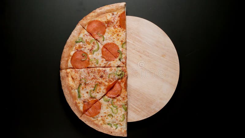 Half of Big Pizza on a Black Background, Top View Stock Image - Image ...