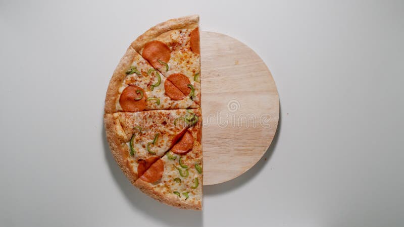 Half of Big Pizza on a White Desk, Top View Stock Photo - Image of ...