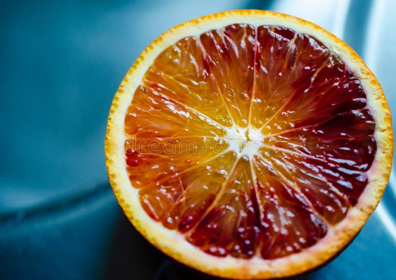 A Half Blood Orange on a Blue Background Stock Photo - Image of decor ...